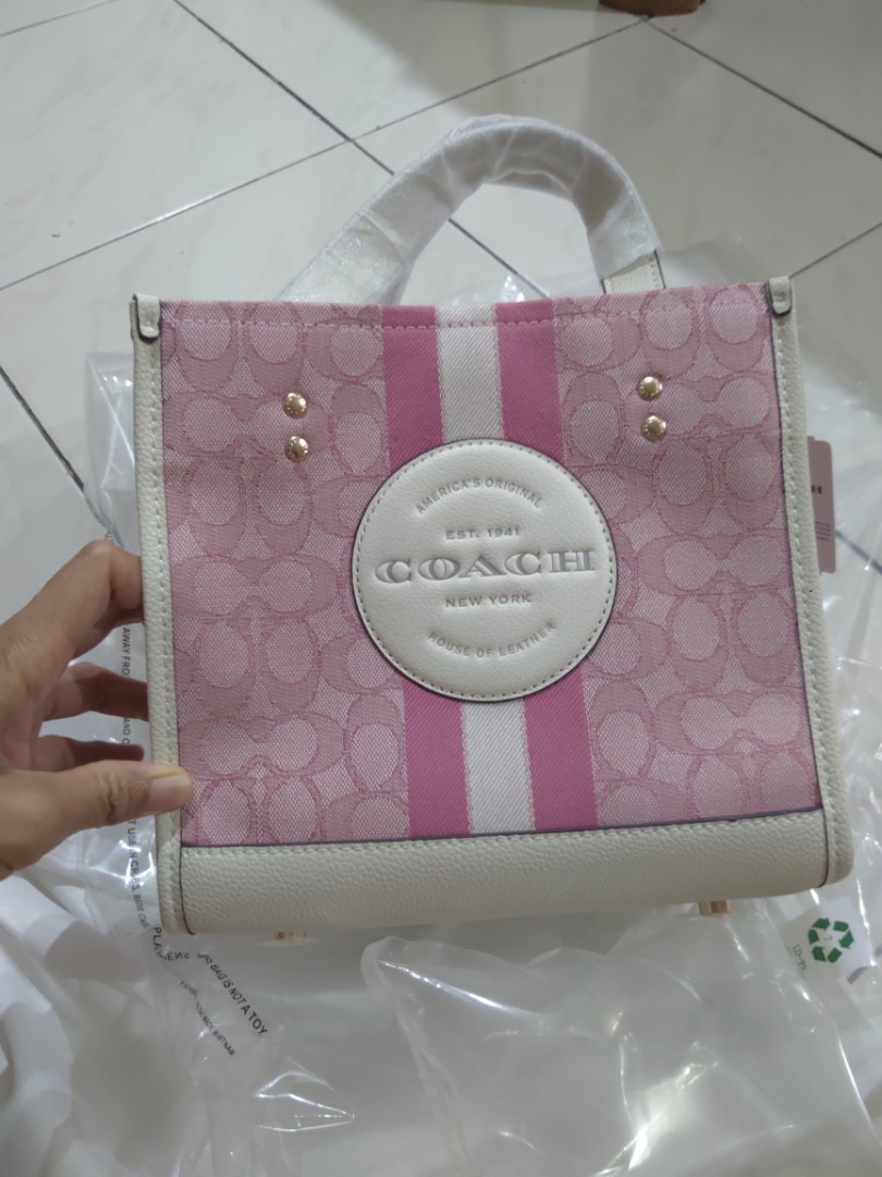 Coach Dempsey tote on Carousell
