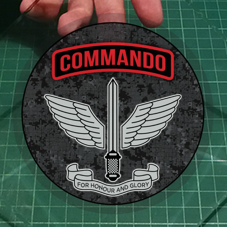 SAF COMMANDO insignia and shoulder tab on black digital camo . Static ...