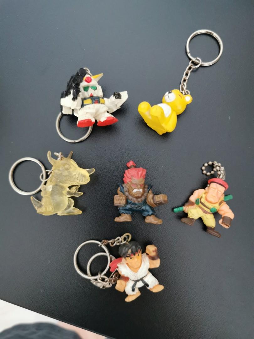 Assorted old school keychains digimon Street fighter gundam and more ...