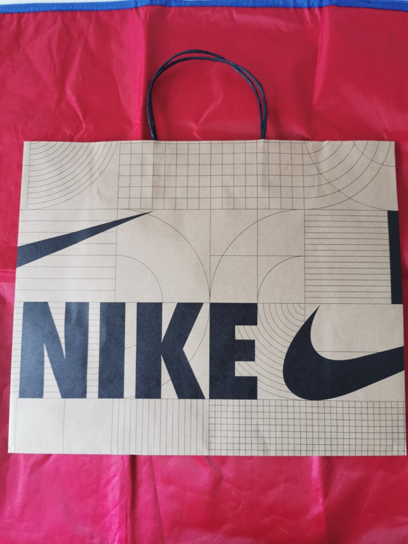 Nike paper bag, Luxury, Bags & Wallets on Carousell