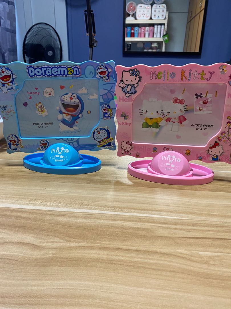 Hello kitty/doramon photo frame, Everything Else on Carousell