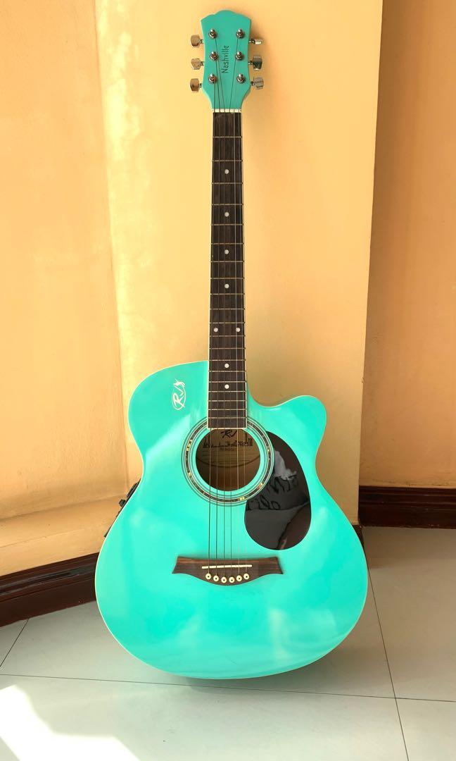 Pre-loved mint green acoustic guitar w/ tuner, extra strings and guitar ...