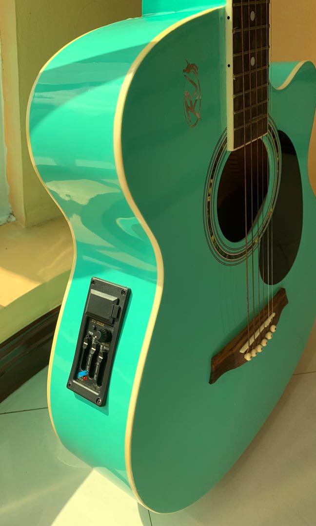 Pre-loved mint green acoustic guitar w/ tuner, extra strings and guitar ...