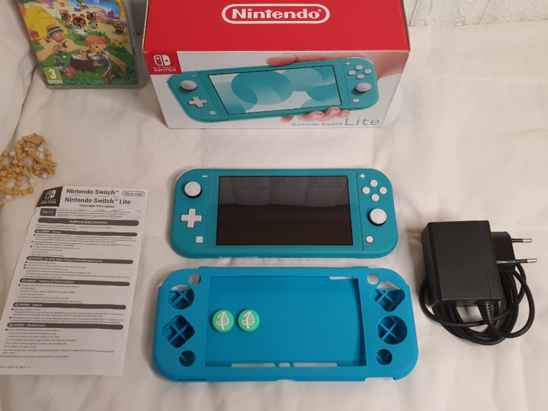 Nintendo Switch Lite Teal Like New with free games, Video Gaming, Video ...