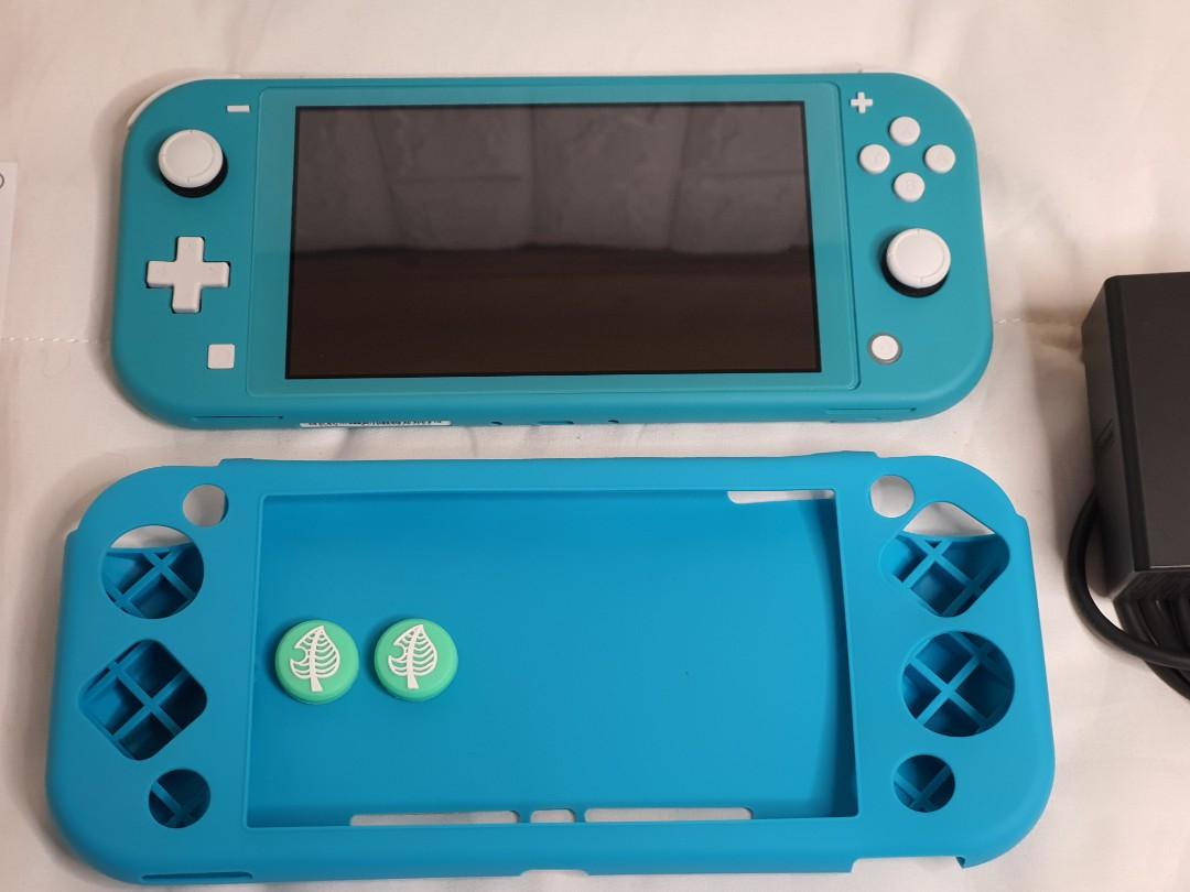 Nintendo Switch Lite Teal Like New with free games, Video Gaming, Video ...
