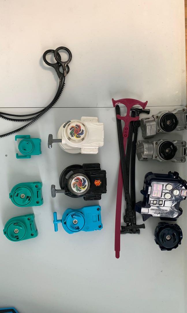 2 Beyblade battle stadiums + 10 beyblade launchers + 8 beyblades + 1 ...