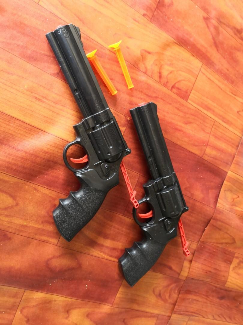 Dual revolvers (2 bullets included), Hobbies & Toys, Toys & Games on ...