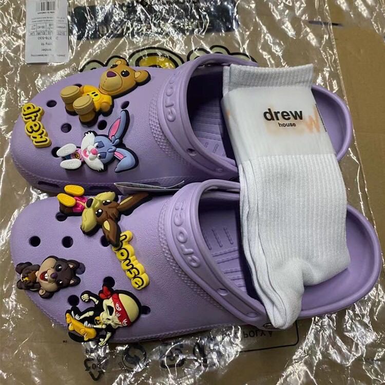Drew house x Crocs, Men's Fashion, Footwear, Slippers & Slides on Carousell