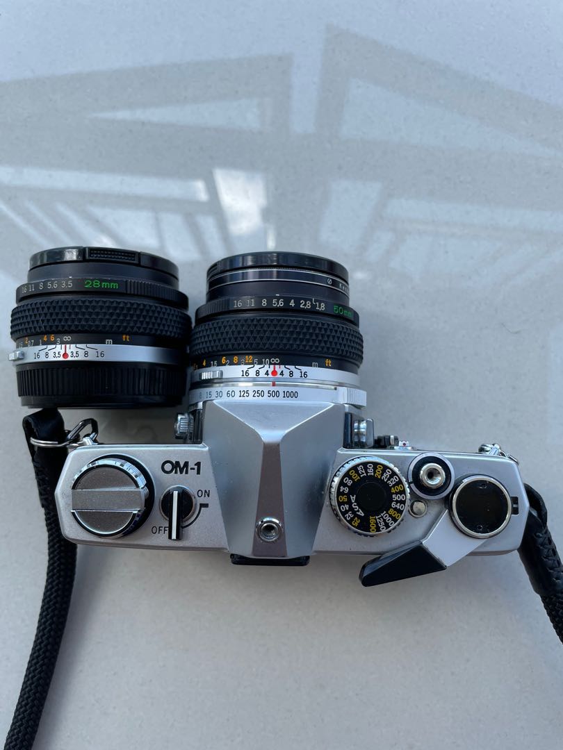 Olympus Om-1 菲林相機+ Zuiko 50mm f1.8+ 28mm f3.5, 攝影器材, 鏡頭及裝備 - Carousell
