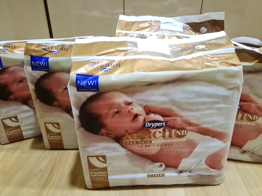 Newborn Baby diapers drypers touch, Babies & Kids, Bathing & Changing ...