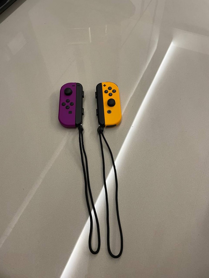 Nintendo switch joy con orange and purple, Video Gaming, Gaming ...