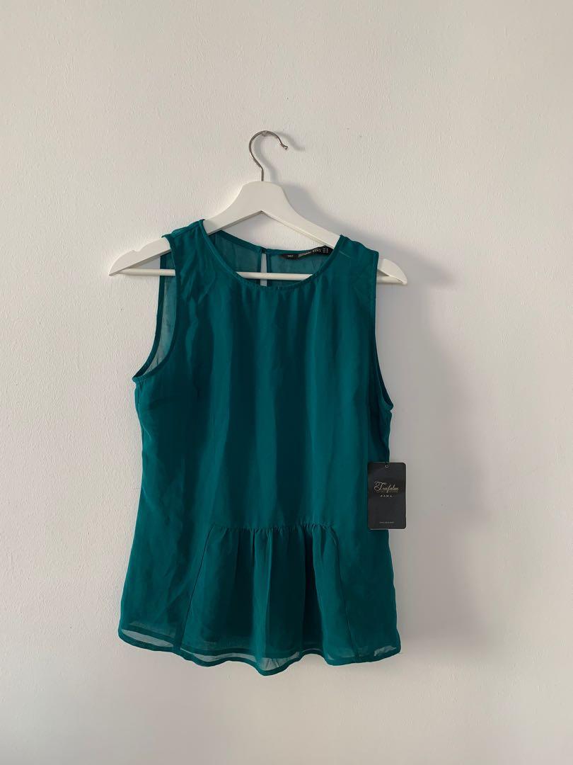 Sleeveless emerald green top with pepullum flap, Women's Fashion, Tops ...