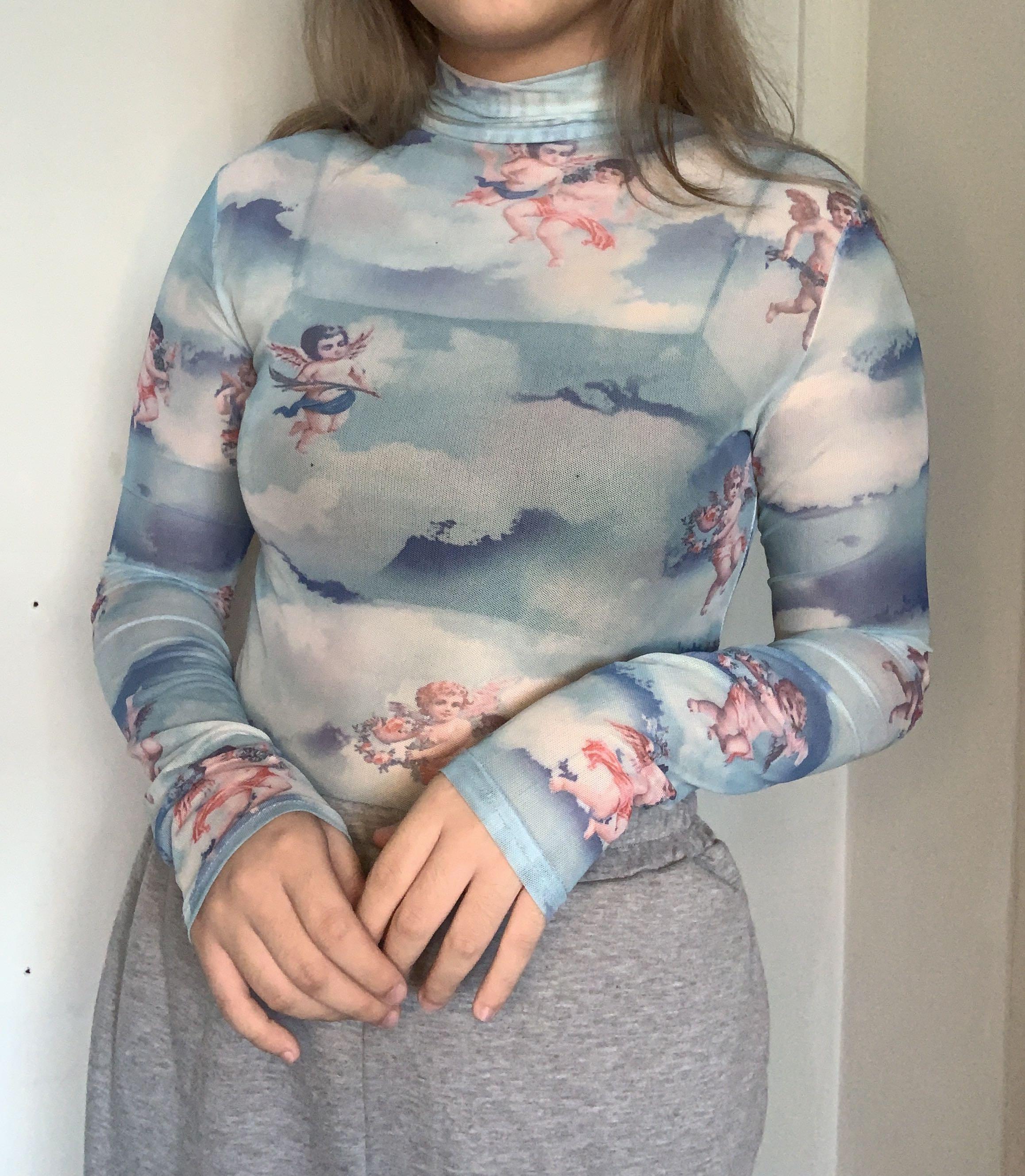 turtleneck angel top, Women's Fashion, Tops, Longsleeves on Carousell