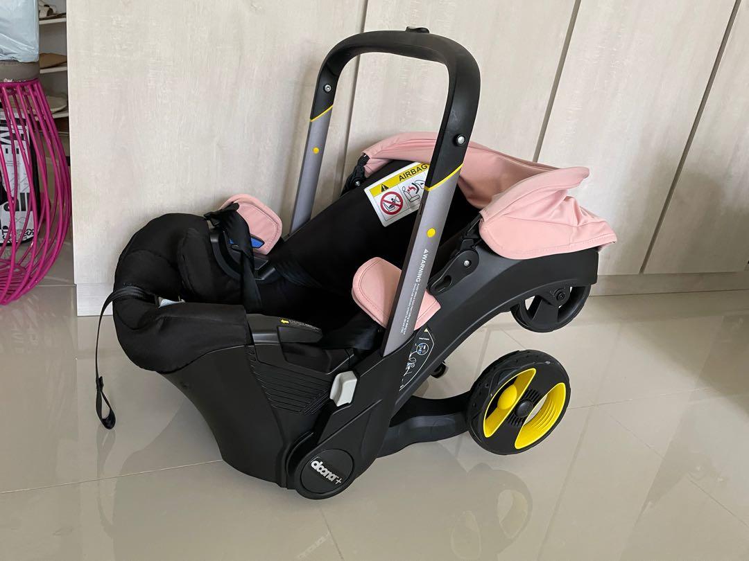 Doona pink stroller with iso fix and bag, Babies & Kids, Going Out ...