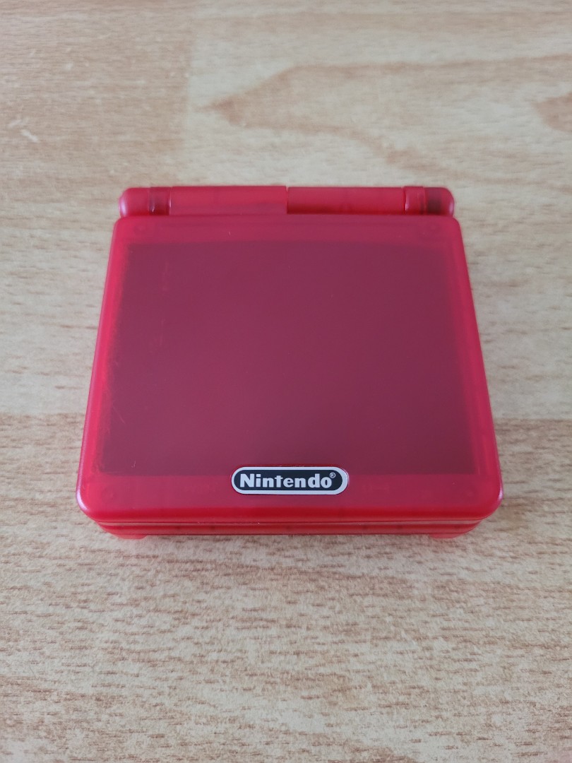 Gameboy advance SP ( translucent red shell and dark grey button ) with ...