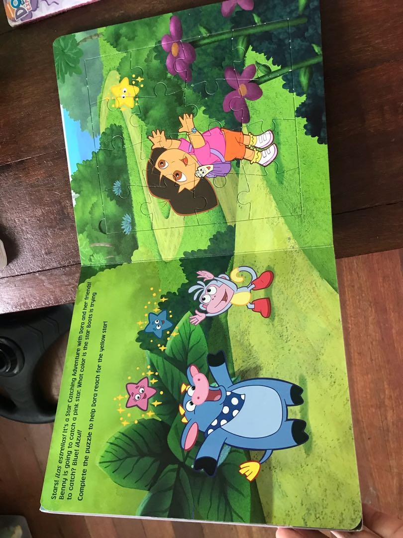 Dora sliding puzzle board books bundle, Hobbies & Toys, Books ...