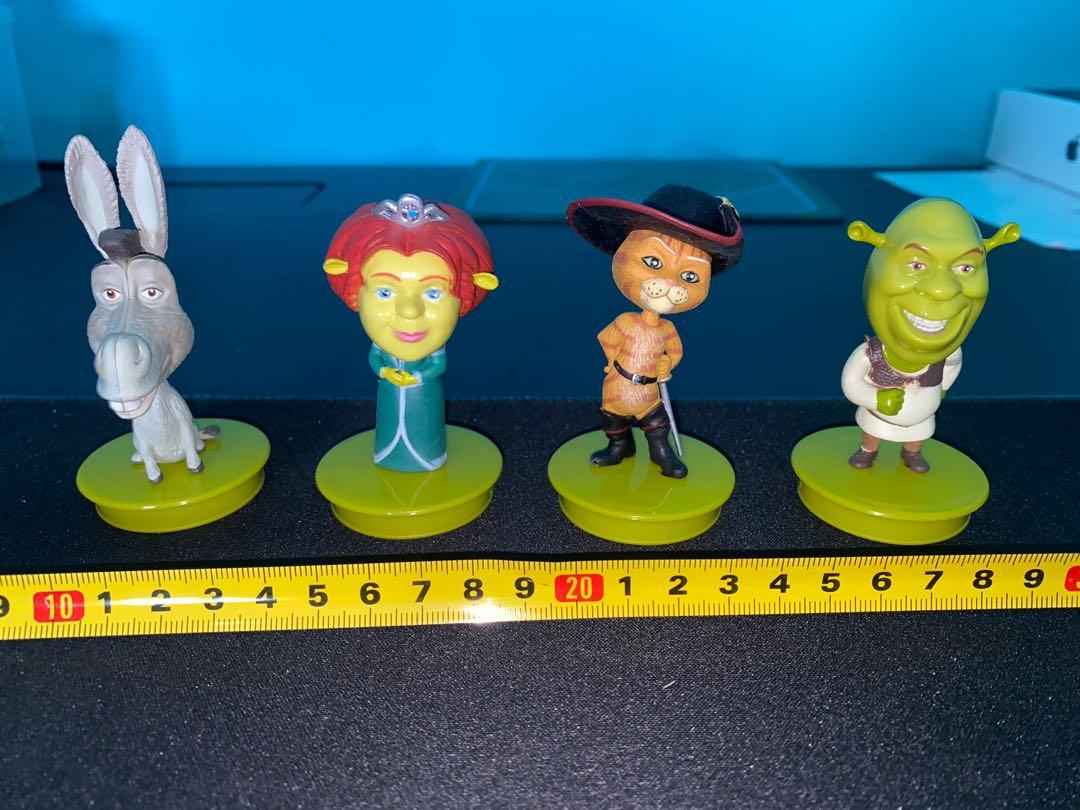 Shrek bobble heads , penguins of Madagascar, puss in boots , lord of ...