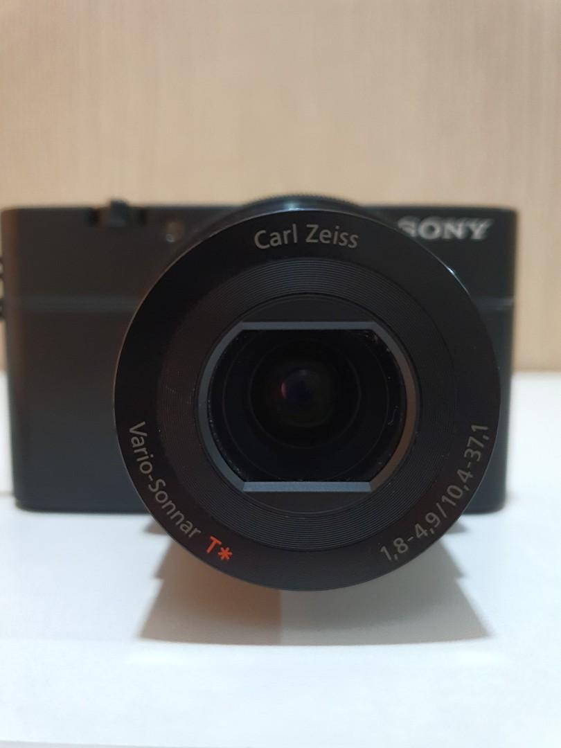 Sony RX100 camera with SD card and case, Photography, Cameras on Carousell