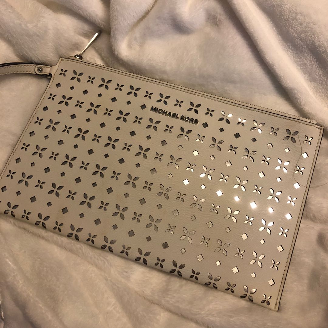 Michael Kors Laser Cut Pouch, Luxury, Bags & Wallets on Carousell