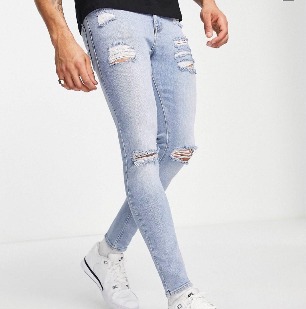 Light blue ripped jeans, Men's Fashion, Bottoms, Jeans on Carousell