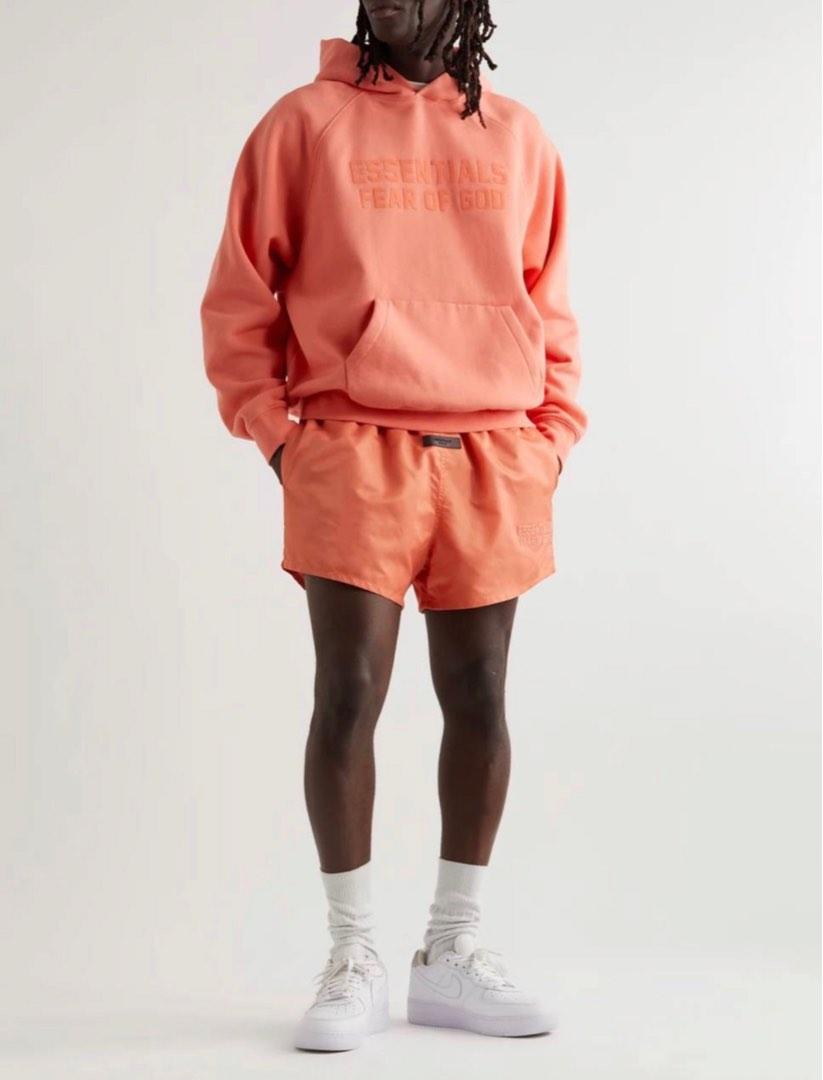 Fear of God Essentials hoodie in coral, Men's Fashion, Activewear on ...