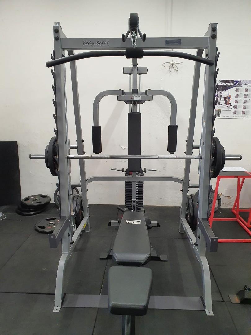 Multi function gym station + workout bench + barbell + olympic weighted ...