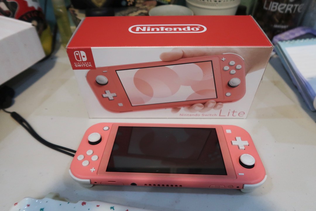Nintendo Switch Lite Coral Pink w/ freebies! (Slightly negotiable ...