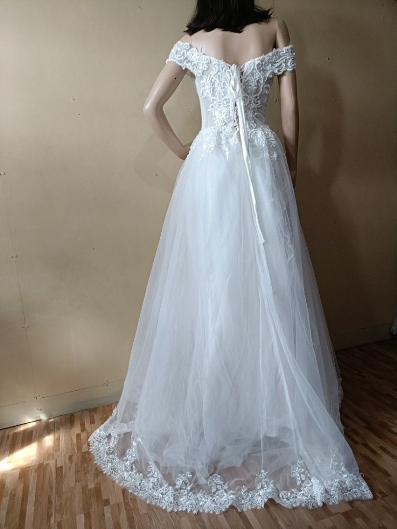Elegant Beaded Off Shoulder wedding gown with open chest detail and see ...