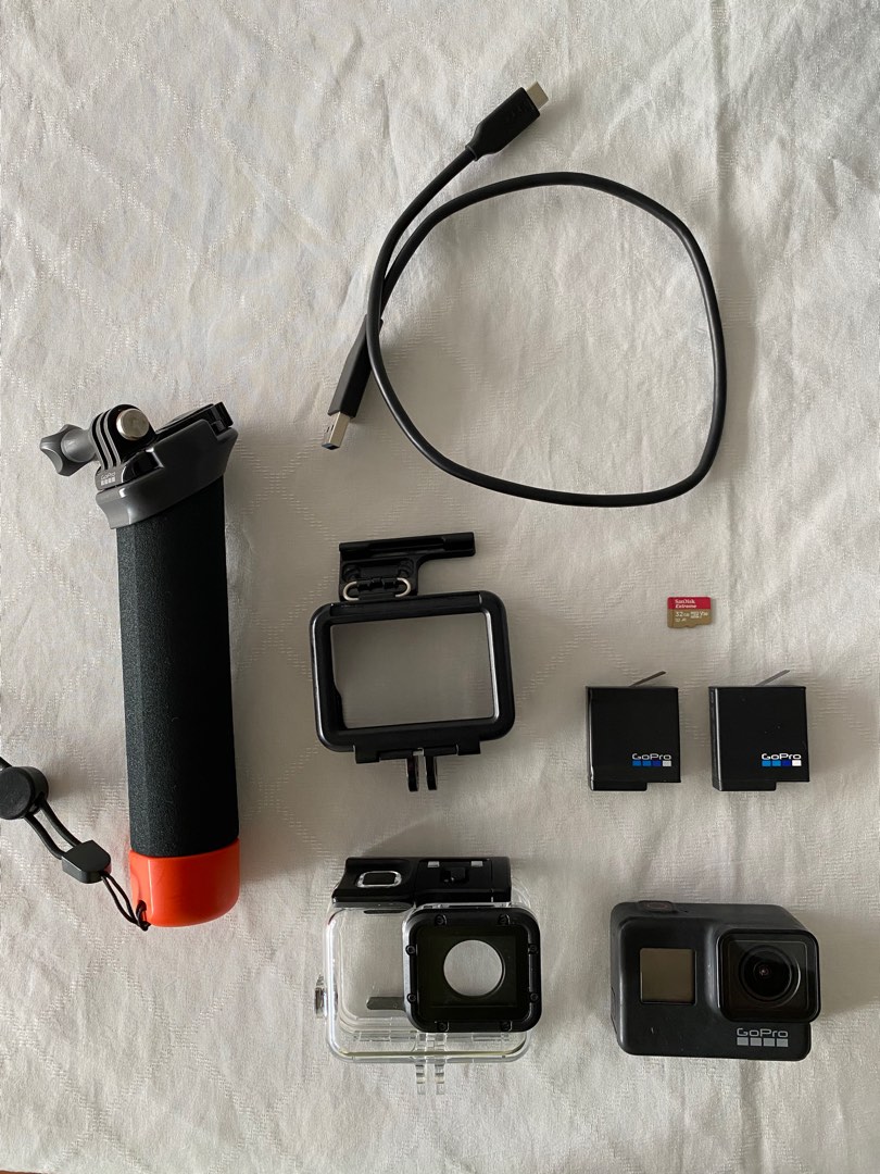 Gopro Hero 7 with batteries and casing, Photography, Cameras on Carousell