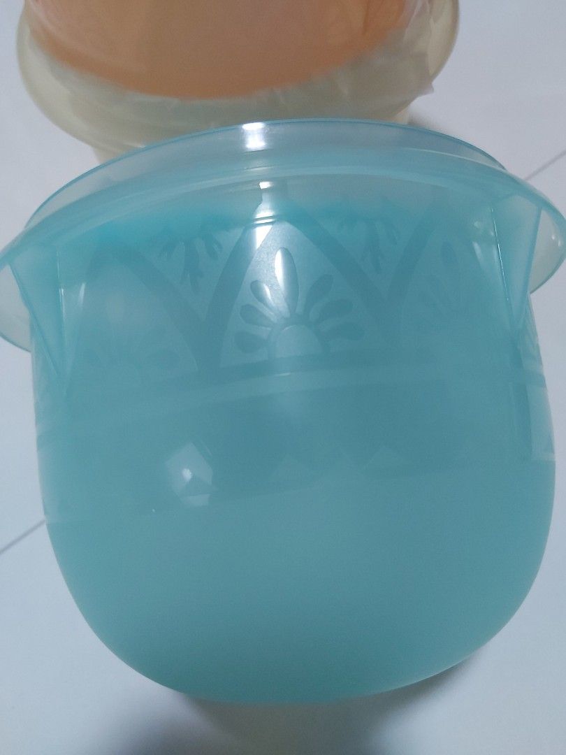 Tupperware round containers with patterns at the side., Furniture ...