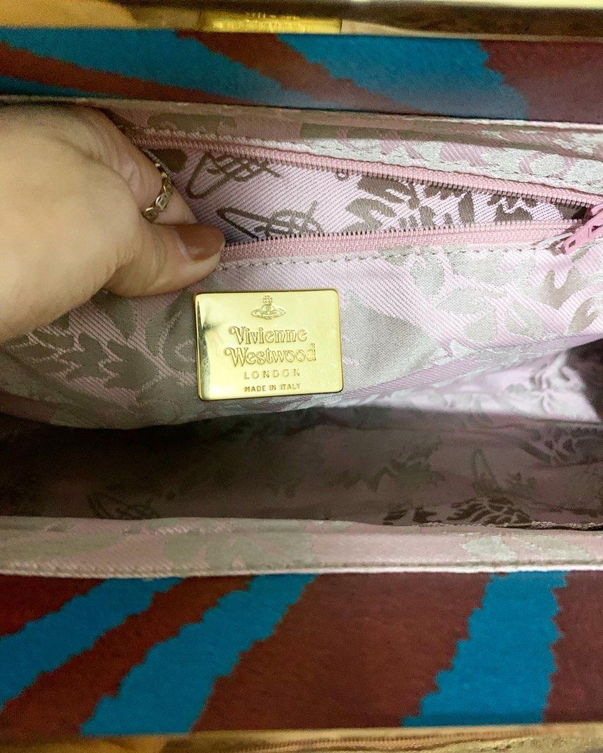 vivienne westwood clutch, Luxury, Bags & Wallets on Carousell