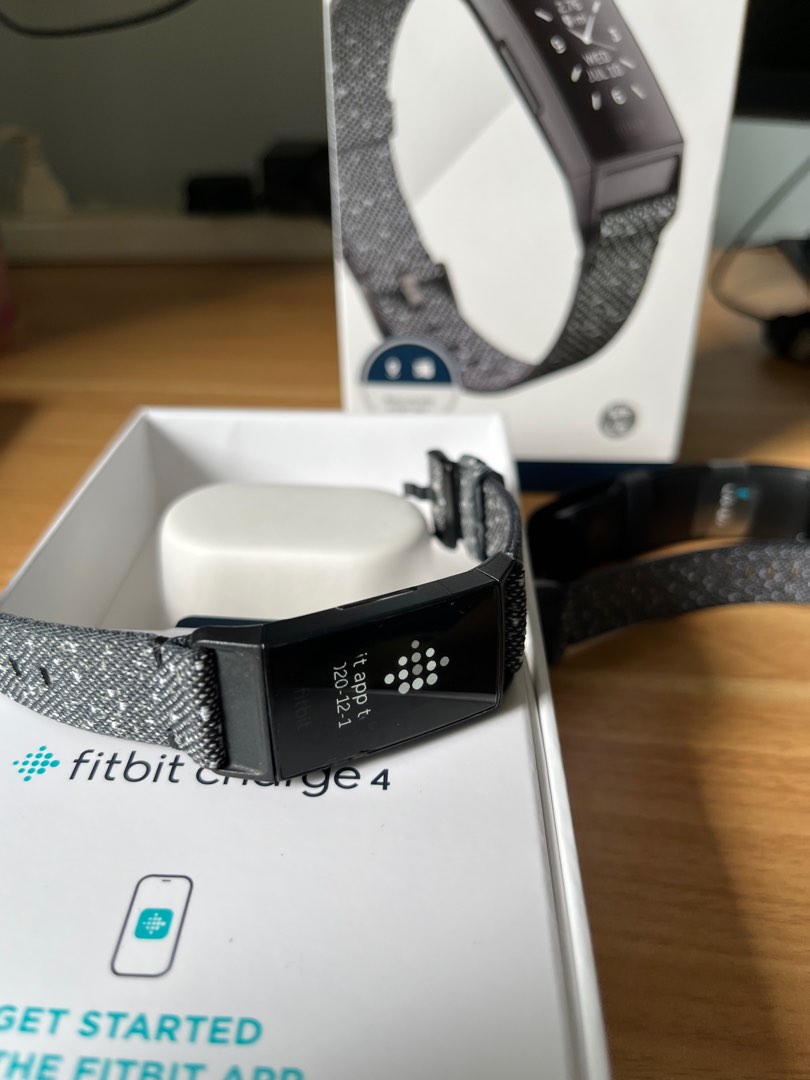 Fitbit Charge 4 with charger, replacement bands and original box ...