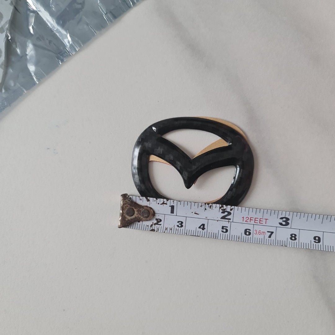 Mazda carbon fiber emblem logo, Car Accessories, Accessories on Carousell