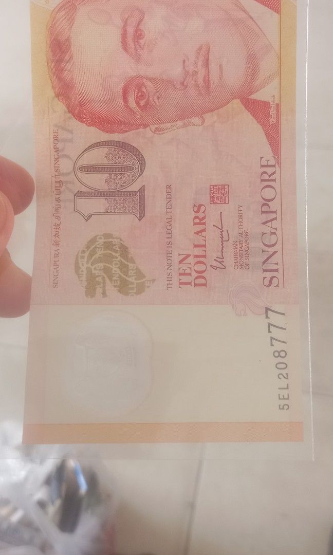 $10 dollar note . No pinhole ,tear .But rhs corner has a creased line ...