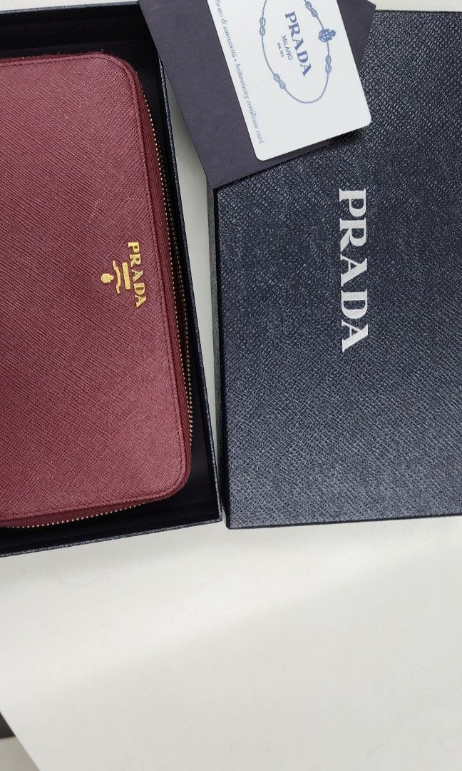 Prada zip wallet, Luxury, Bags & Wallets on Carousell