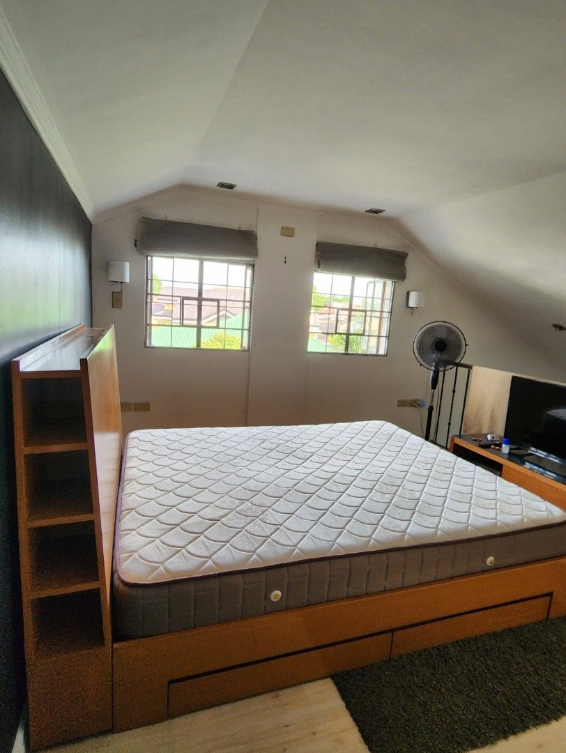 Solid wooden custom-made bed frame with drawers underneath and shelving ...