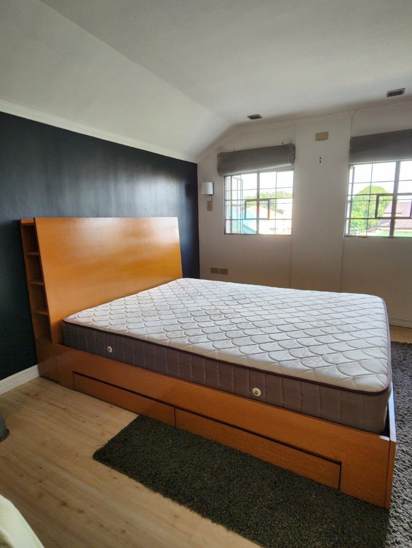 Solid wooden custom-made bed frame with drawers underneath and shelving ...