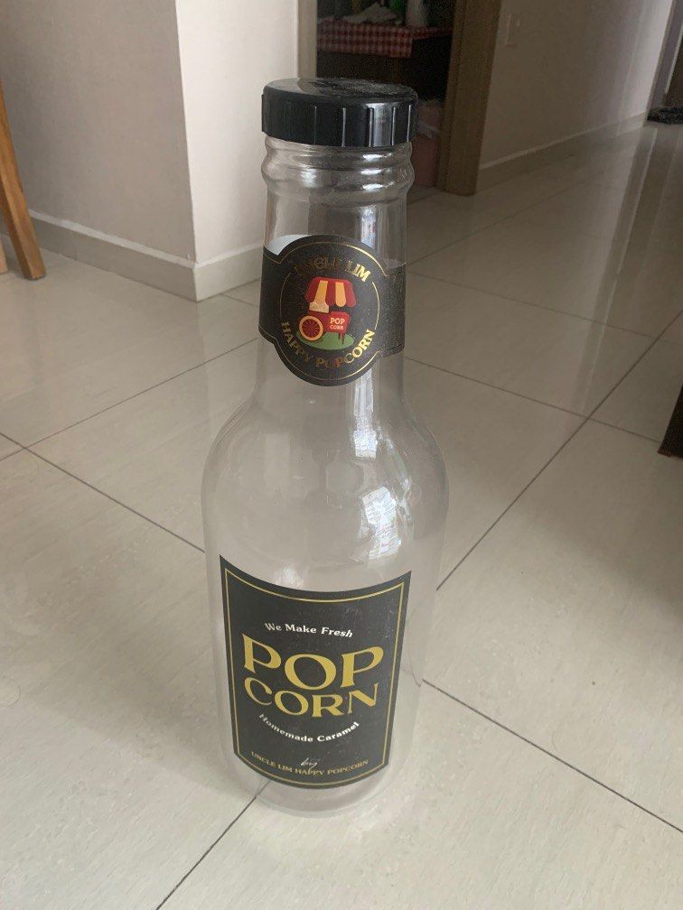 Big empty bottle, container , piggy bank, uncle Lim happy popcorn ...