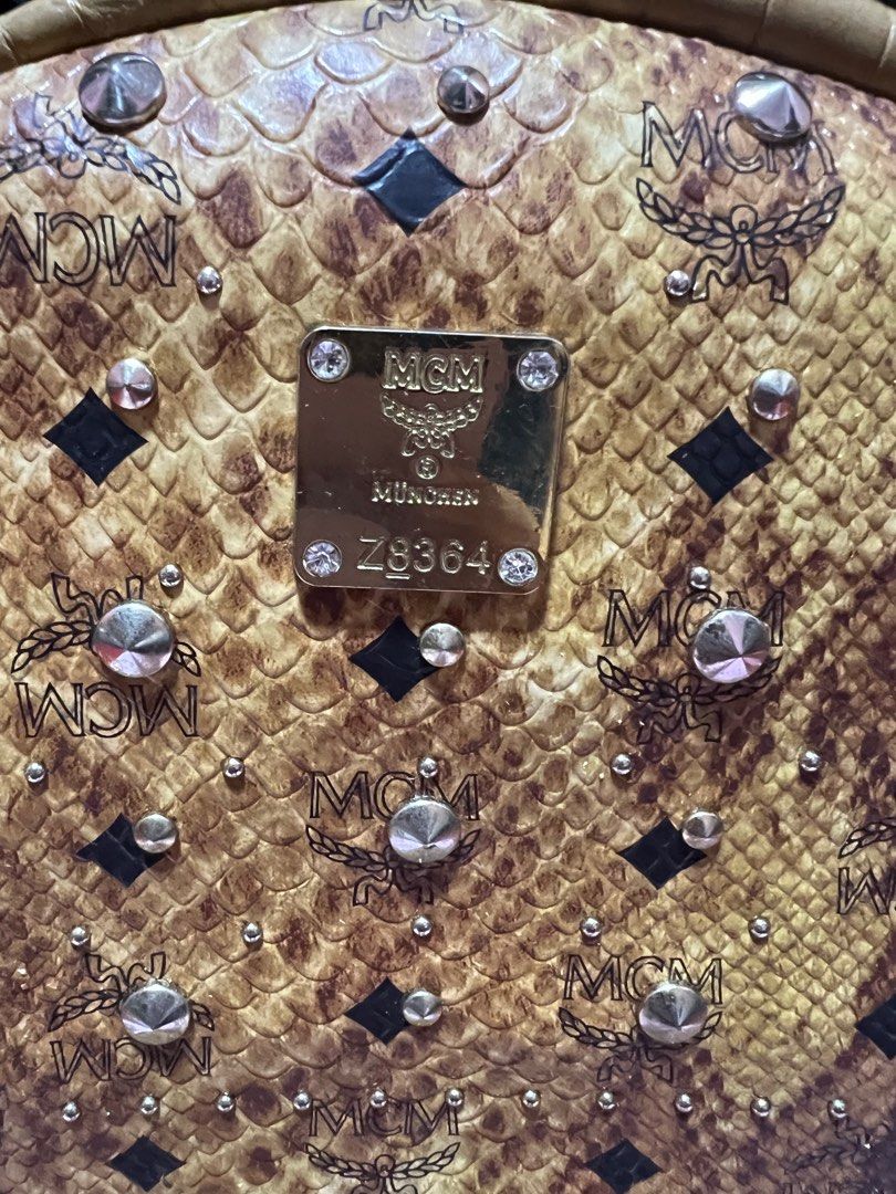 MCM studded backpack in snake skin leather, Luxury, Bags & Wallets on Carousell