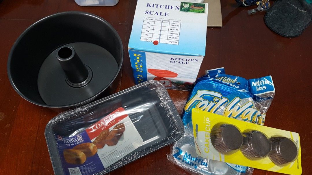Assorted baking ware - loaf and pan, weighing scale, cupcake molds ...