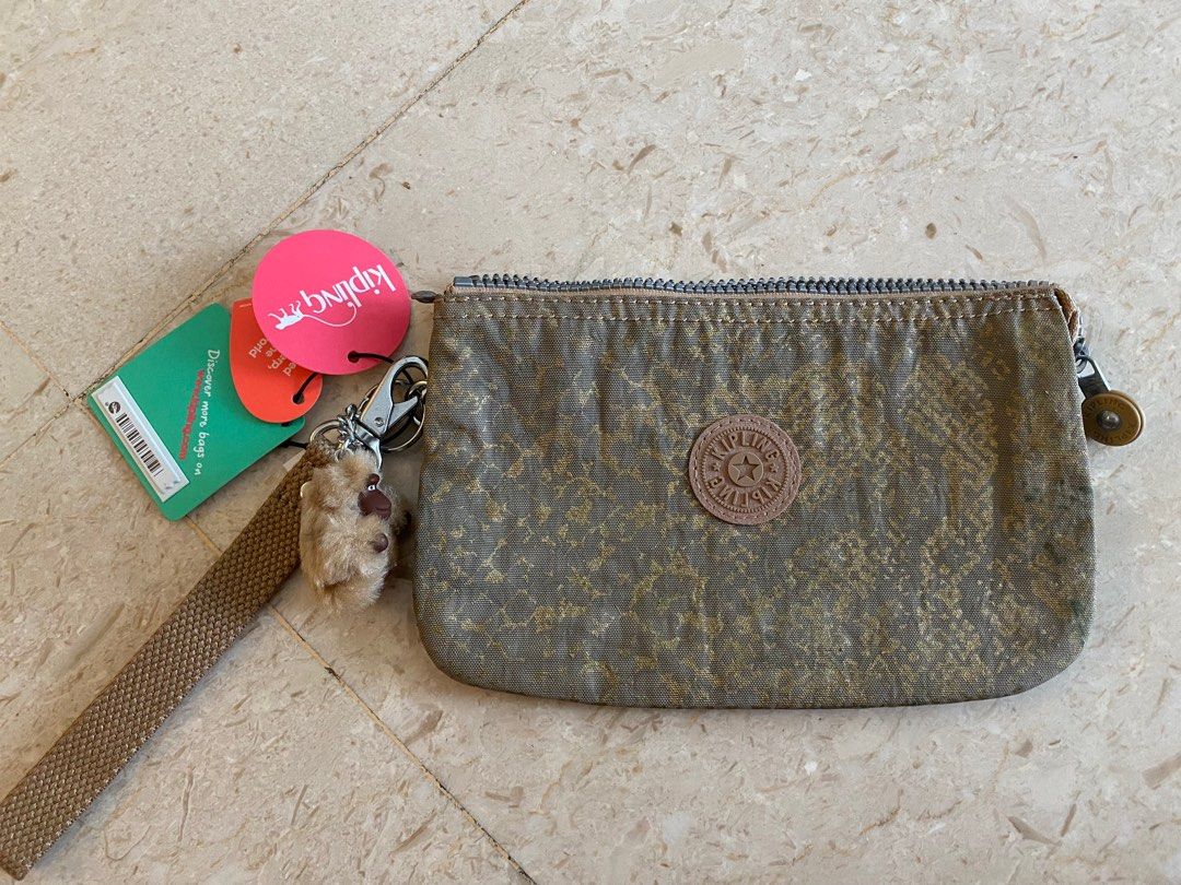 Kipling pouch, Women's Fashion, Bags & Wallets, Purses & Pouches on ...