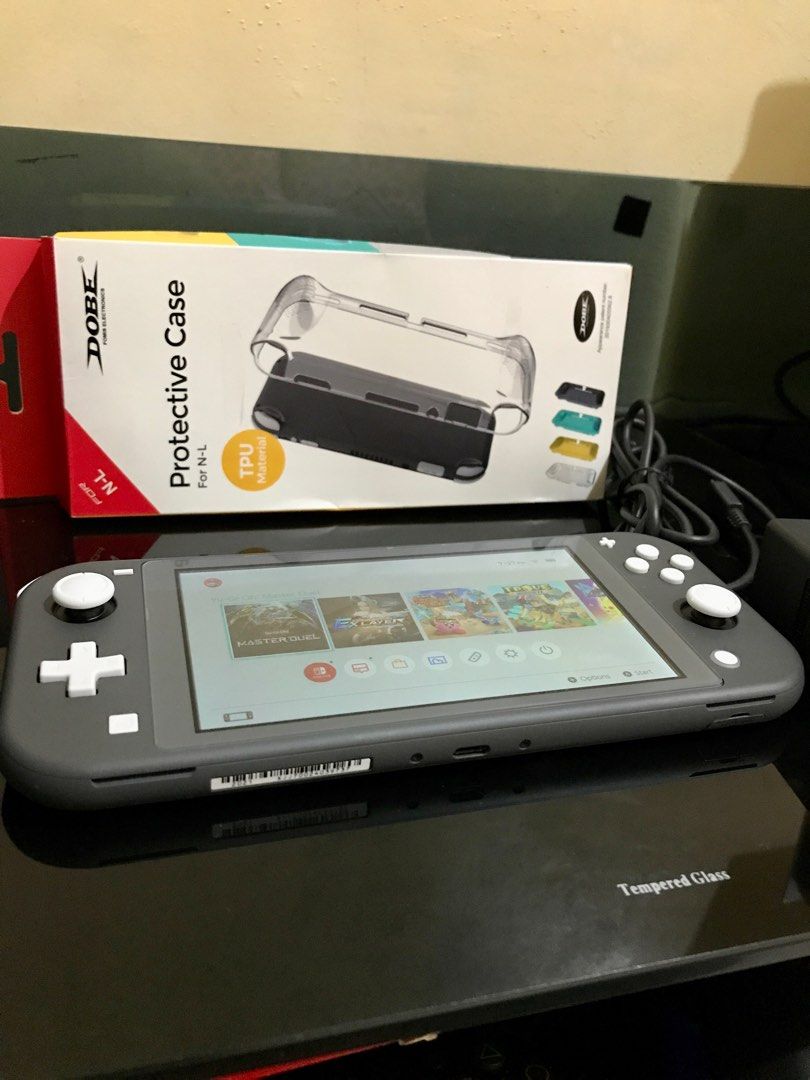 Nintendo switch lite with games, Video Gaming, Video Game Consoles ...