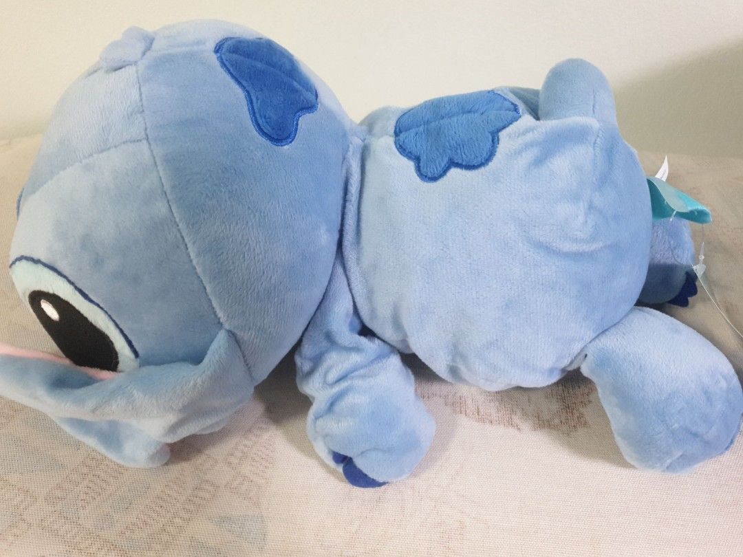 Stitch laying down plush, Hobbies & Toys, Toys & Games on Carousell