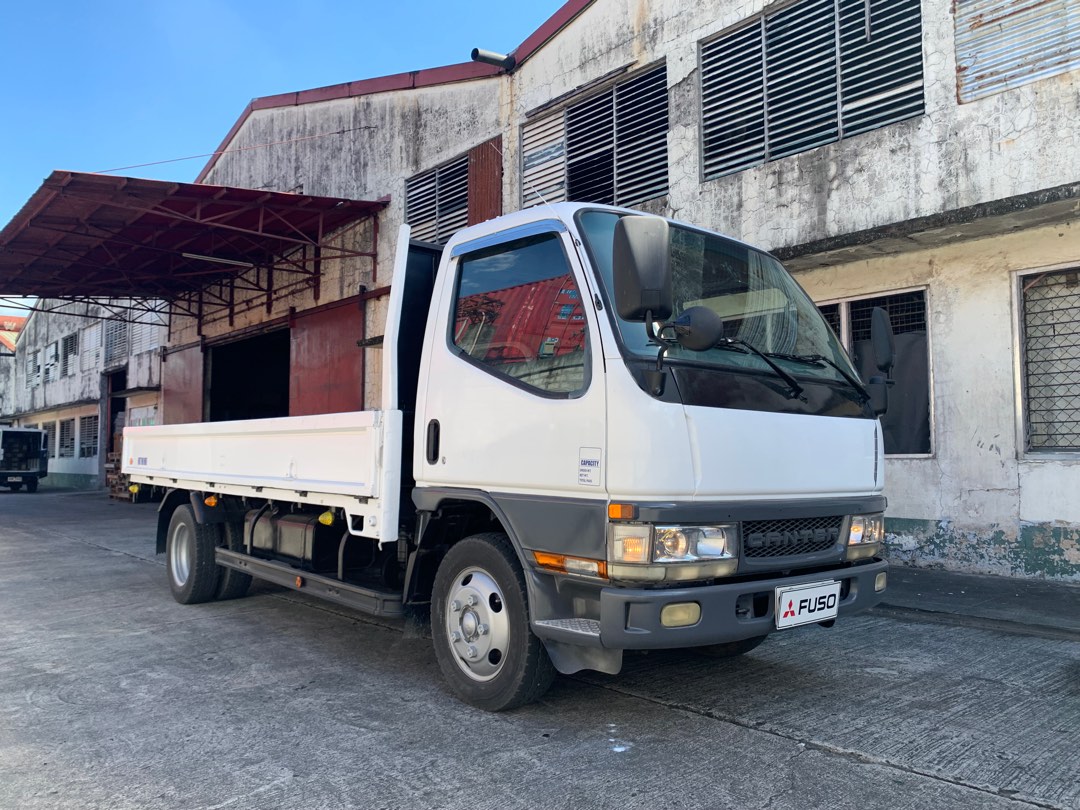 Mitsubishi Fuso Canter Dropside 15 FT Vs Isuzu Elf NKR NPR Forward ...