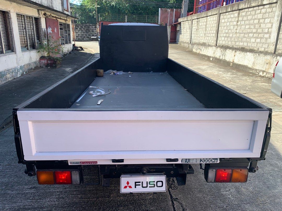 Mitsubishi Fuso Canter Dropside 15 FT Vs Isuzu Elf NKR NPR Forward ...