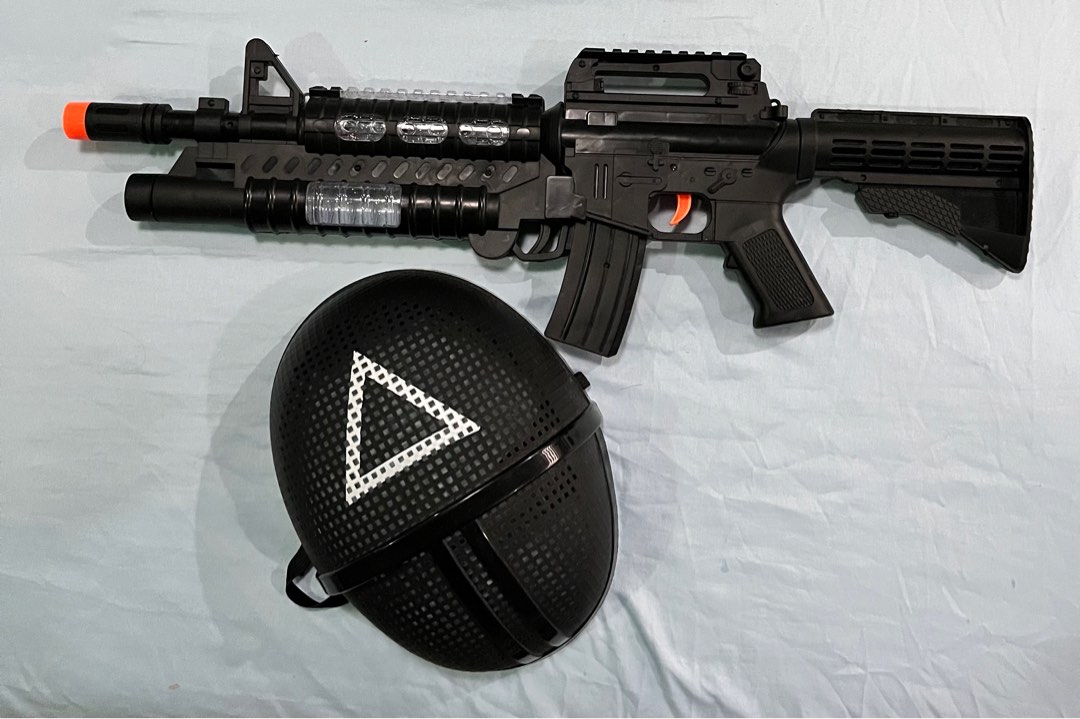 Squid game mask&gun, Hobbies & Toys, Toys & Games on Carousell