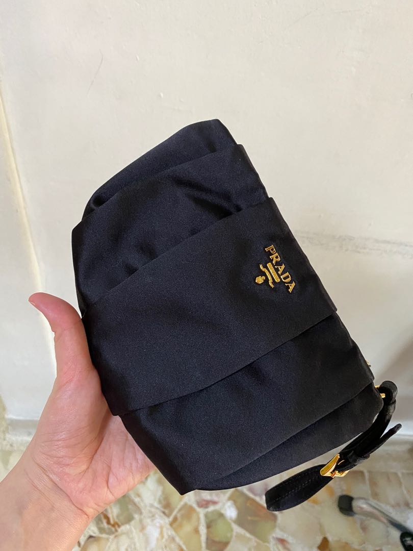 Prada hand pouch, Women's Fashion, Bags & Wallets, Clutches on Carousell