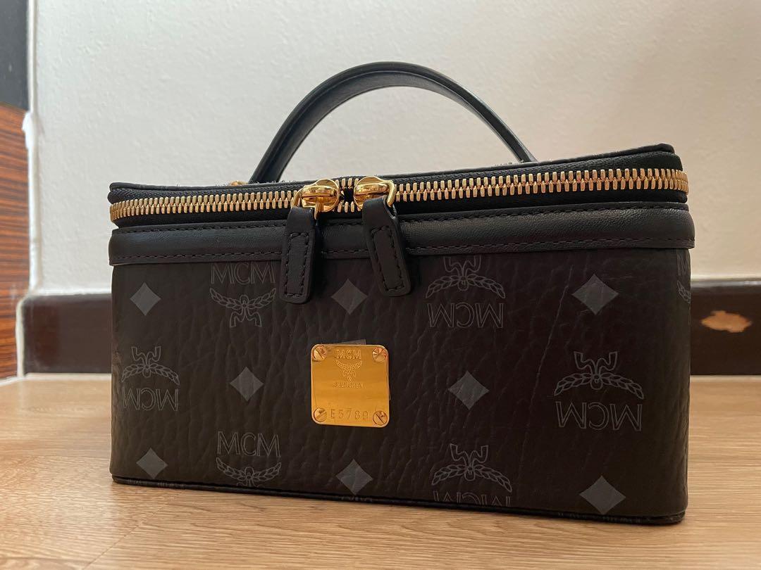 MCM rock star vanity case in black/gold, Women's Fashion, Bags ...