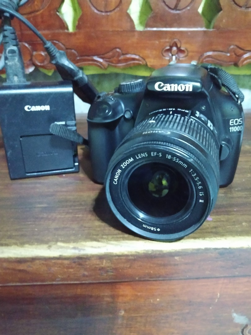 Canon Eos 1100D with charger, Photography, Cameras on Carousell