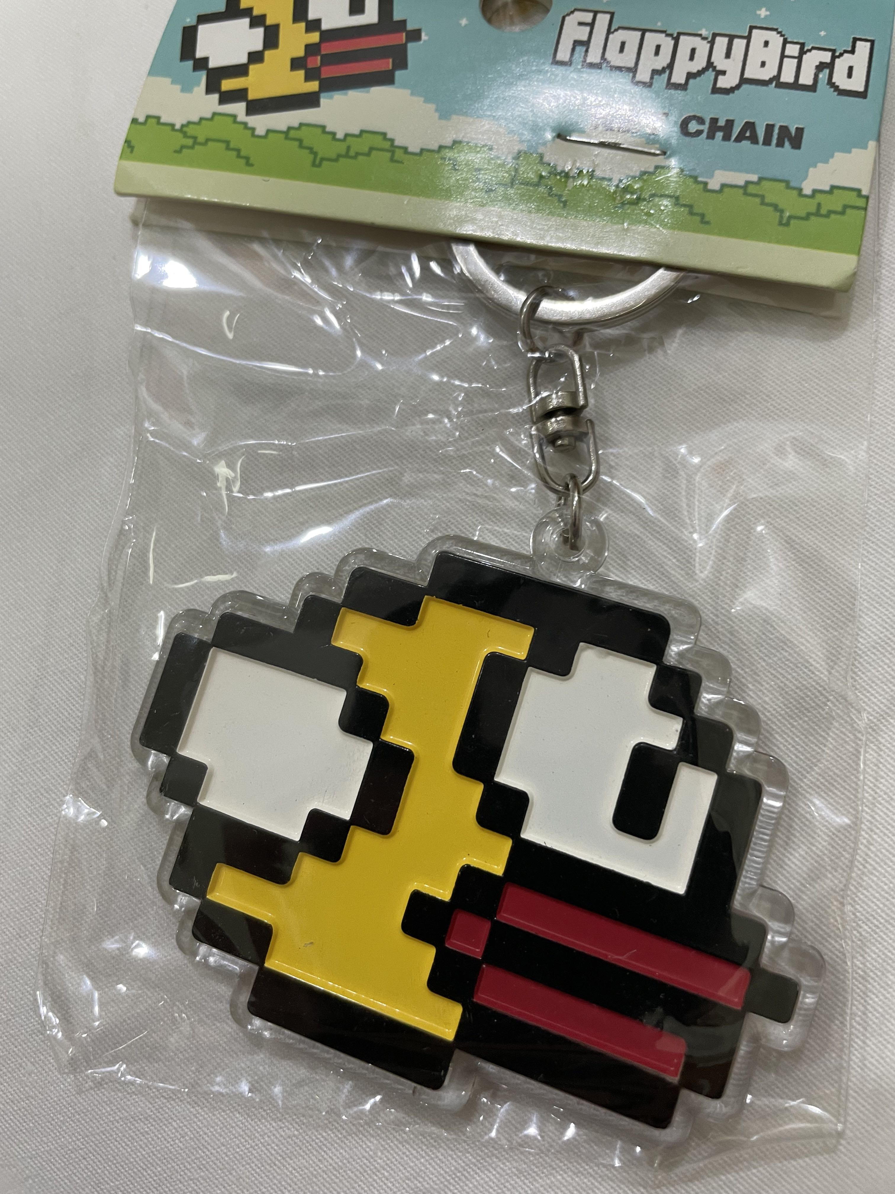 Flappy bird keychain, Everything Else on Carousell